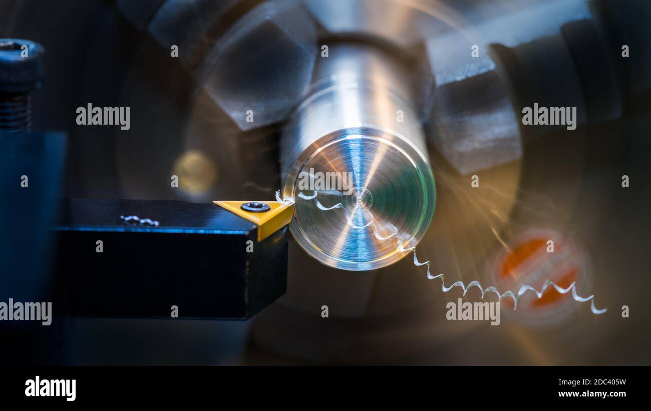 Close-up of turning. Sharp tool bit on dark background. Cutting tool ...