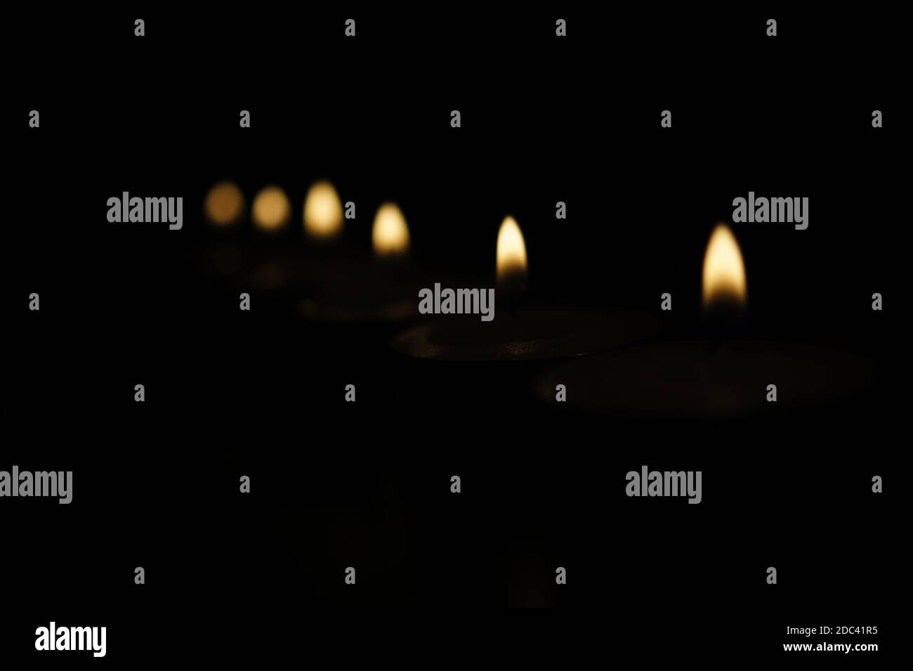 Lighting line tea candles hi-res stock photography and images - Alamy