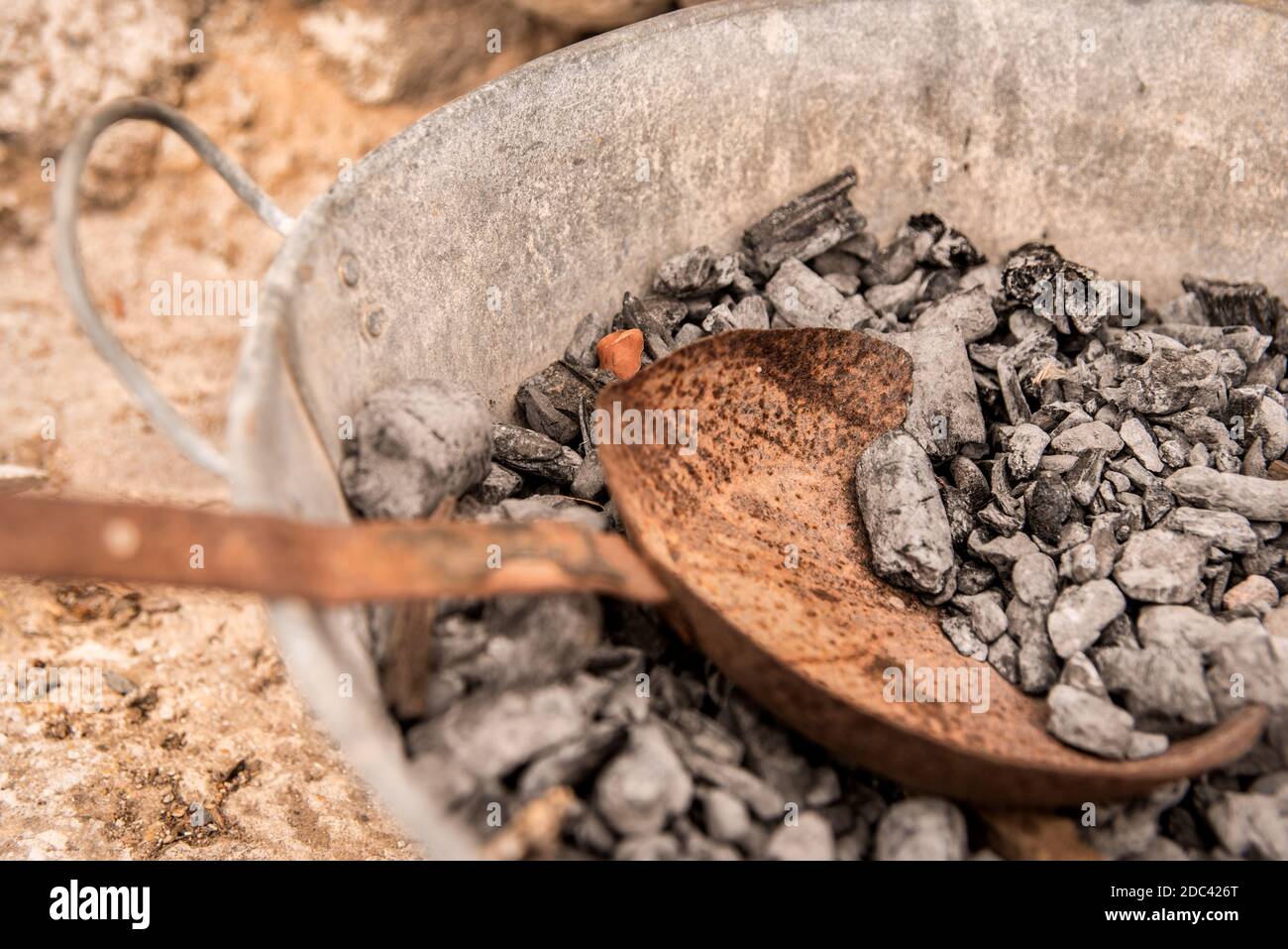 remains of fire inside an ancient bucket Stock Photo - Alamy