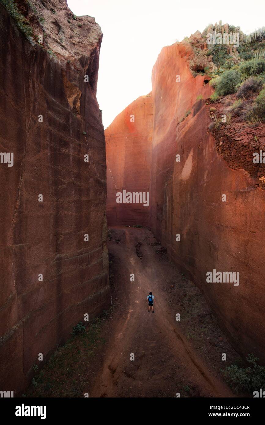 gorge in a mountain and a path where a person is seen walking Stock ...