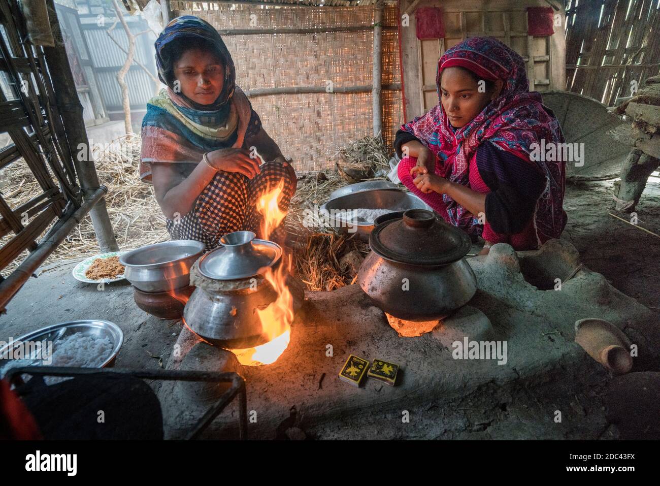 Babul Mia's wife Halima Akter (left) and Abul Hossain's wife Amena ...