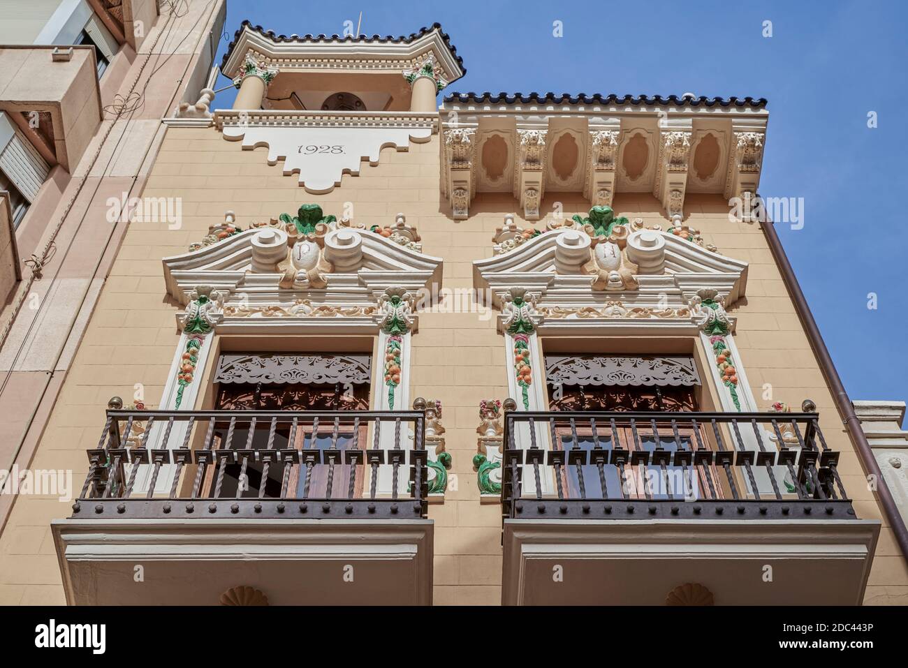 facade of a building with ornate brickwork around the balconies and ...