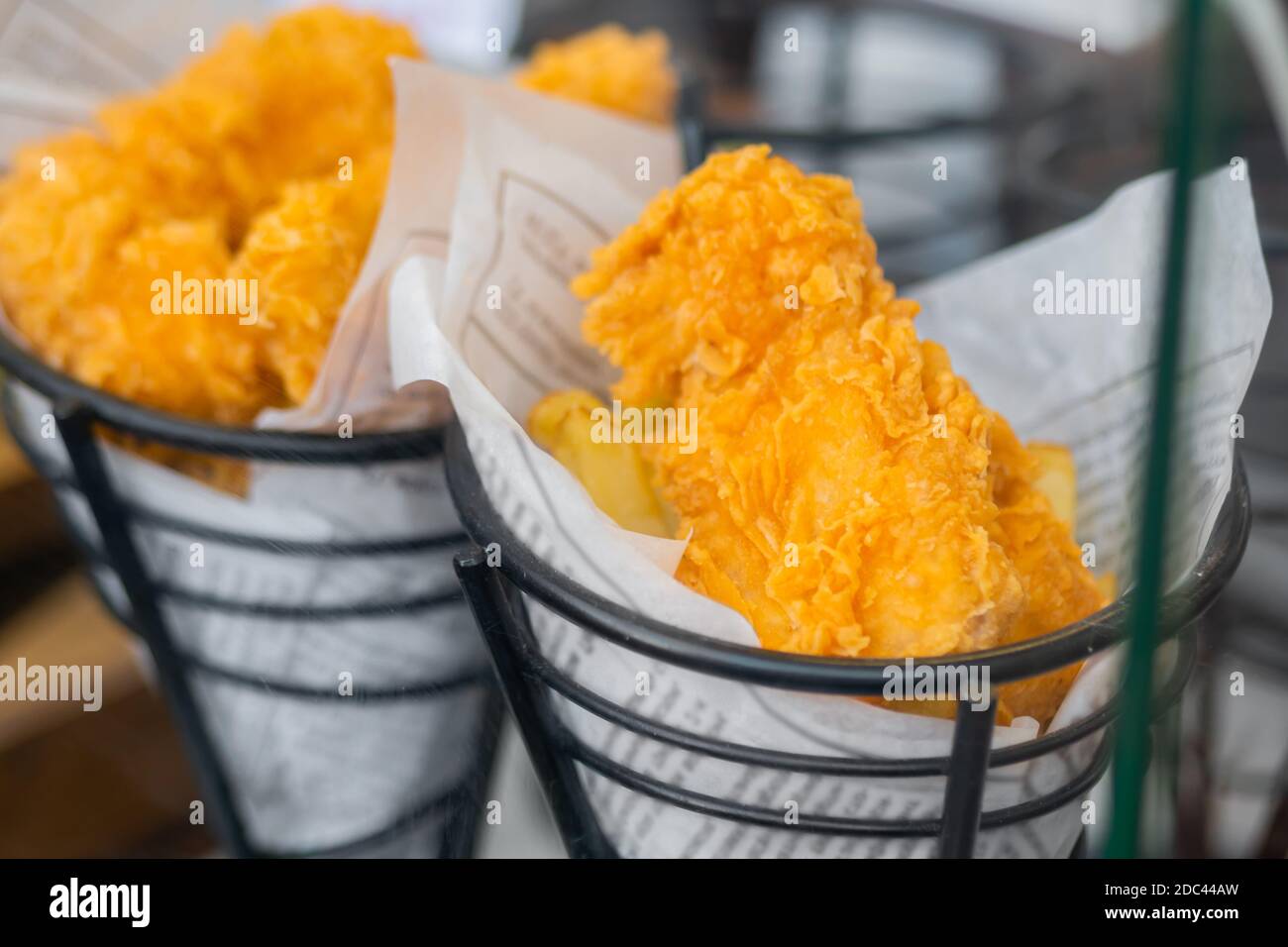 Fish wrapped in newspaper hi-res stock photography and images - Alamy