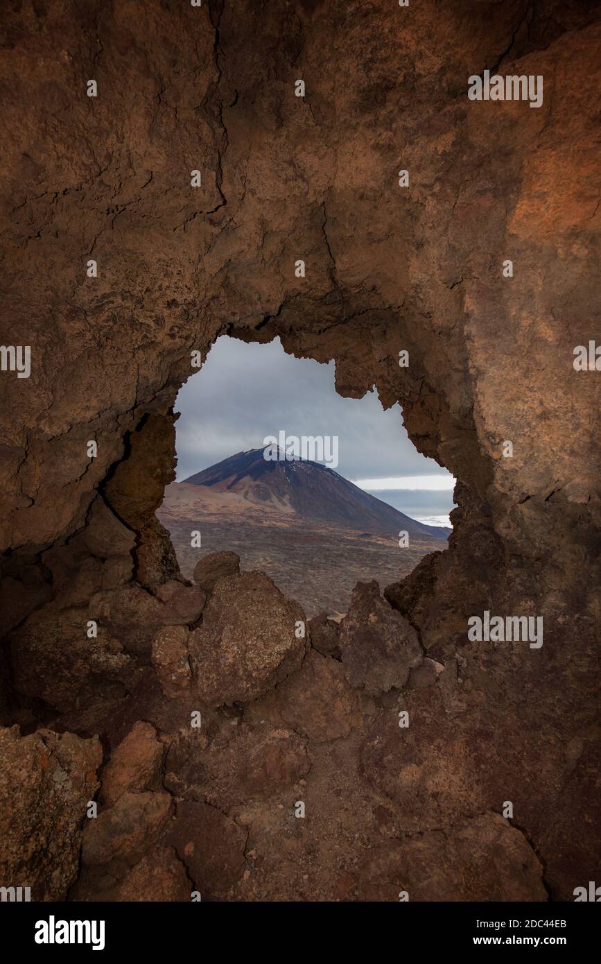 a mountain is seen through a rock window warm and soft tones Stock ...