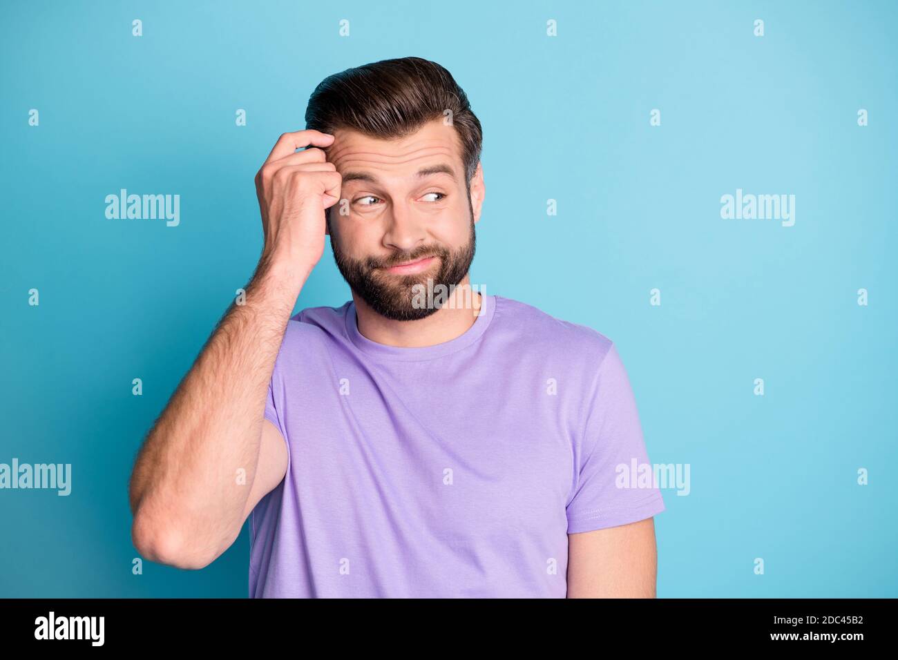 Photo of young attractive man hesitate uncertain thoughtful hands touch ...