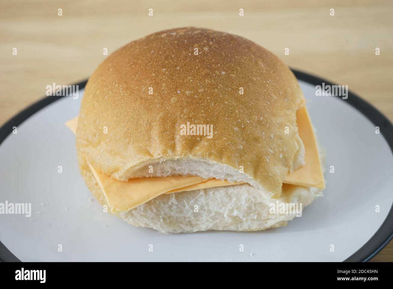 Single cheese roll on a plate hi-res stock photography and images - Alamy