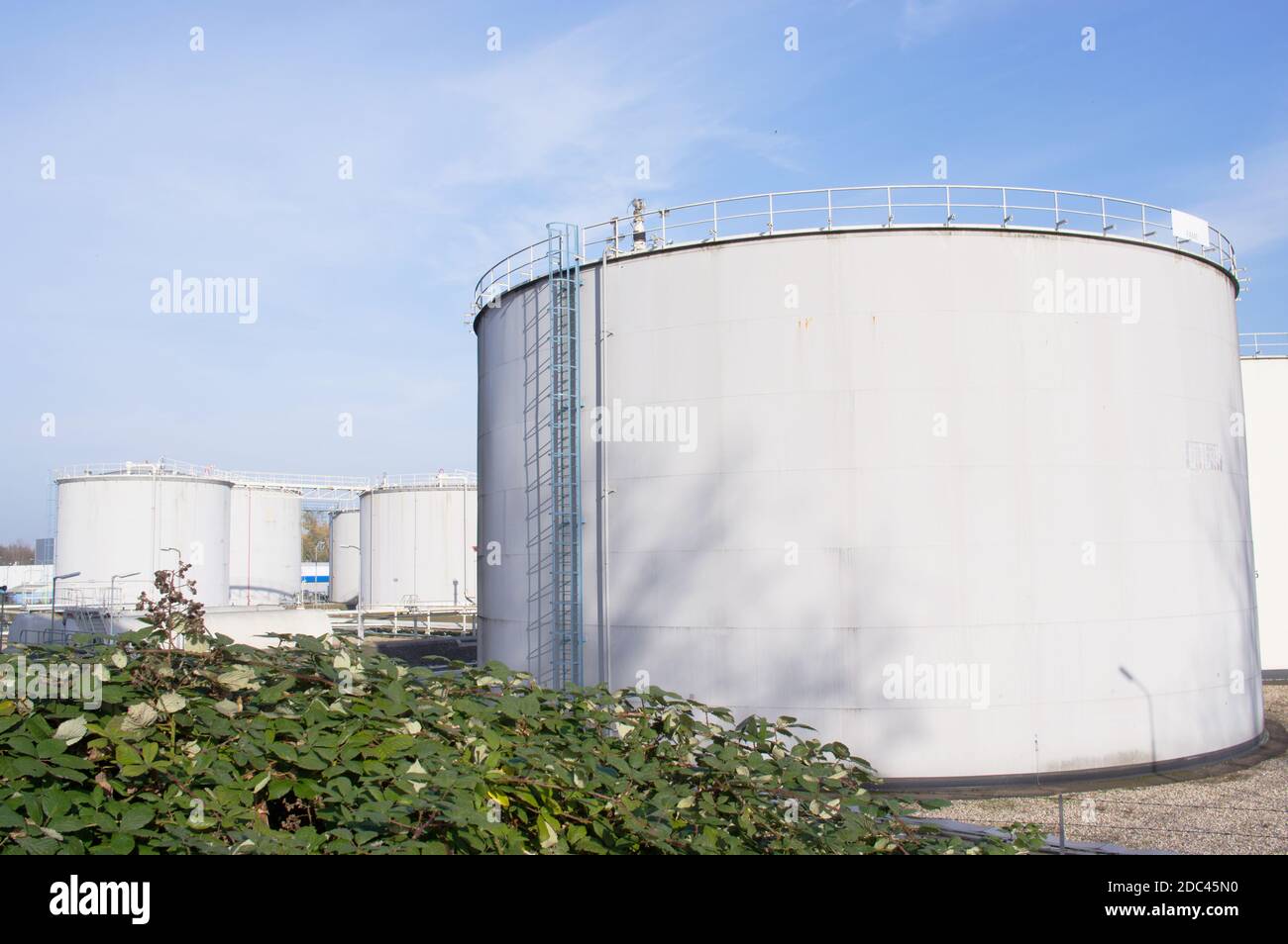 Large grey industrial tanks for petrol and oil storage in Arnhem ...