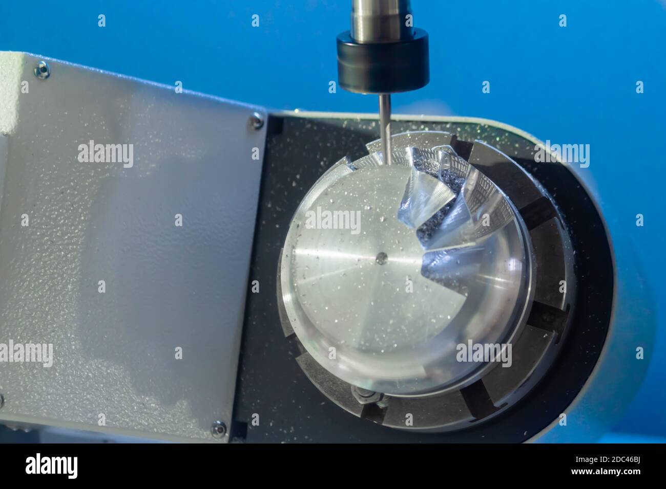 Automatic turning milling machine cutting metal workpiece at factory ...