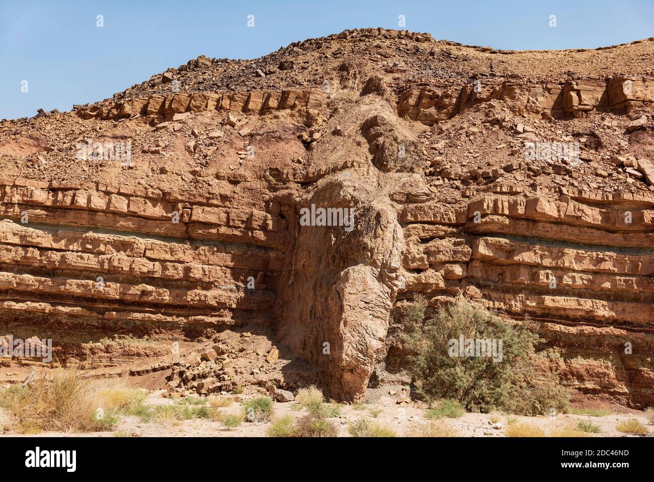 a massive thick magmatic intrusion dike in the red limestone cliff of ...