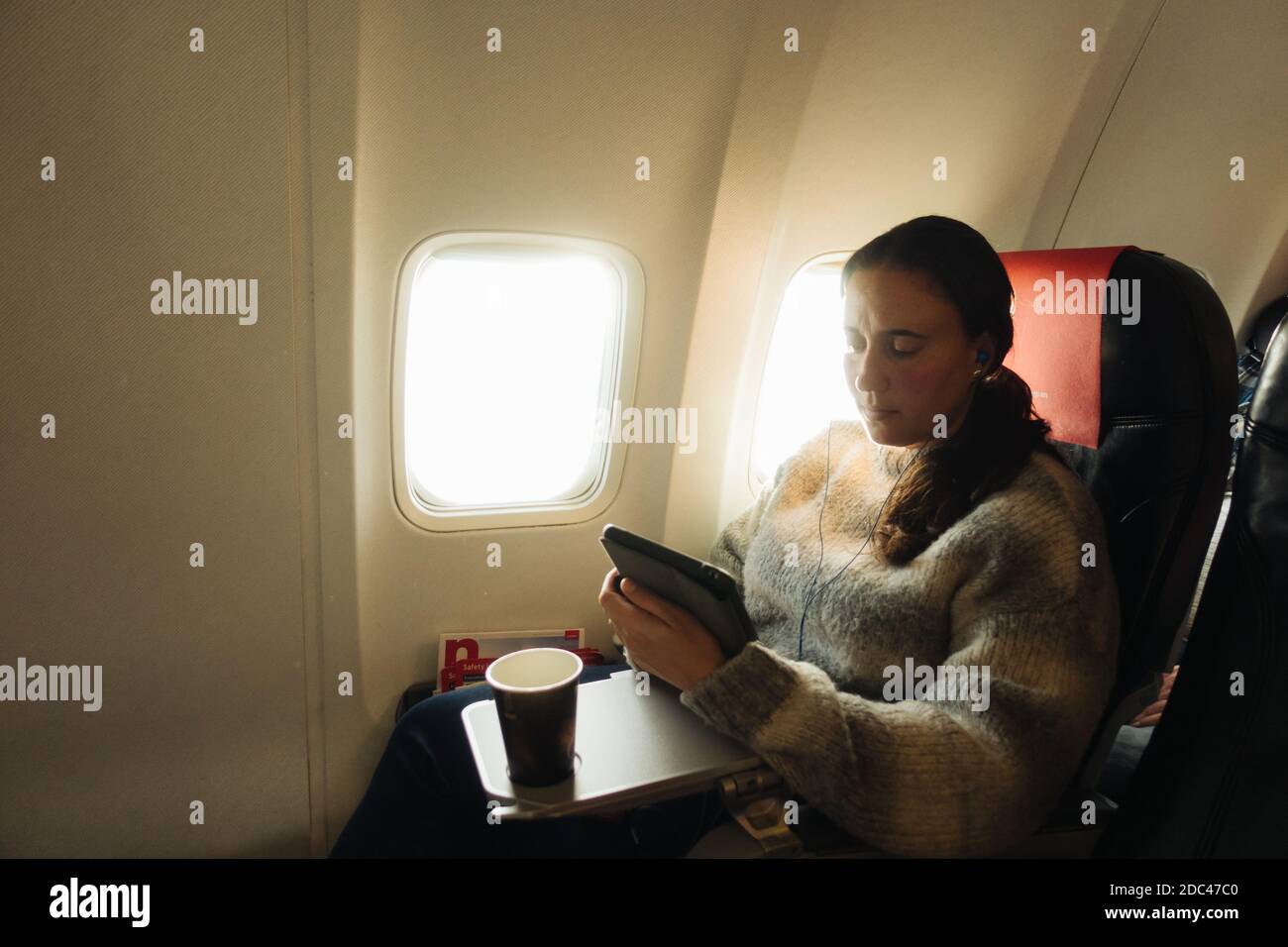 Businessman cell phone plane hi-res stock photography and images - Alamy