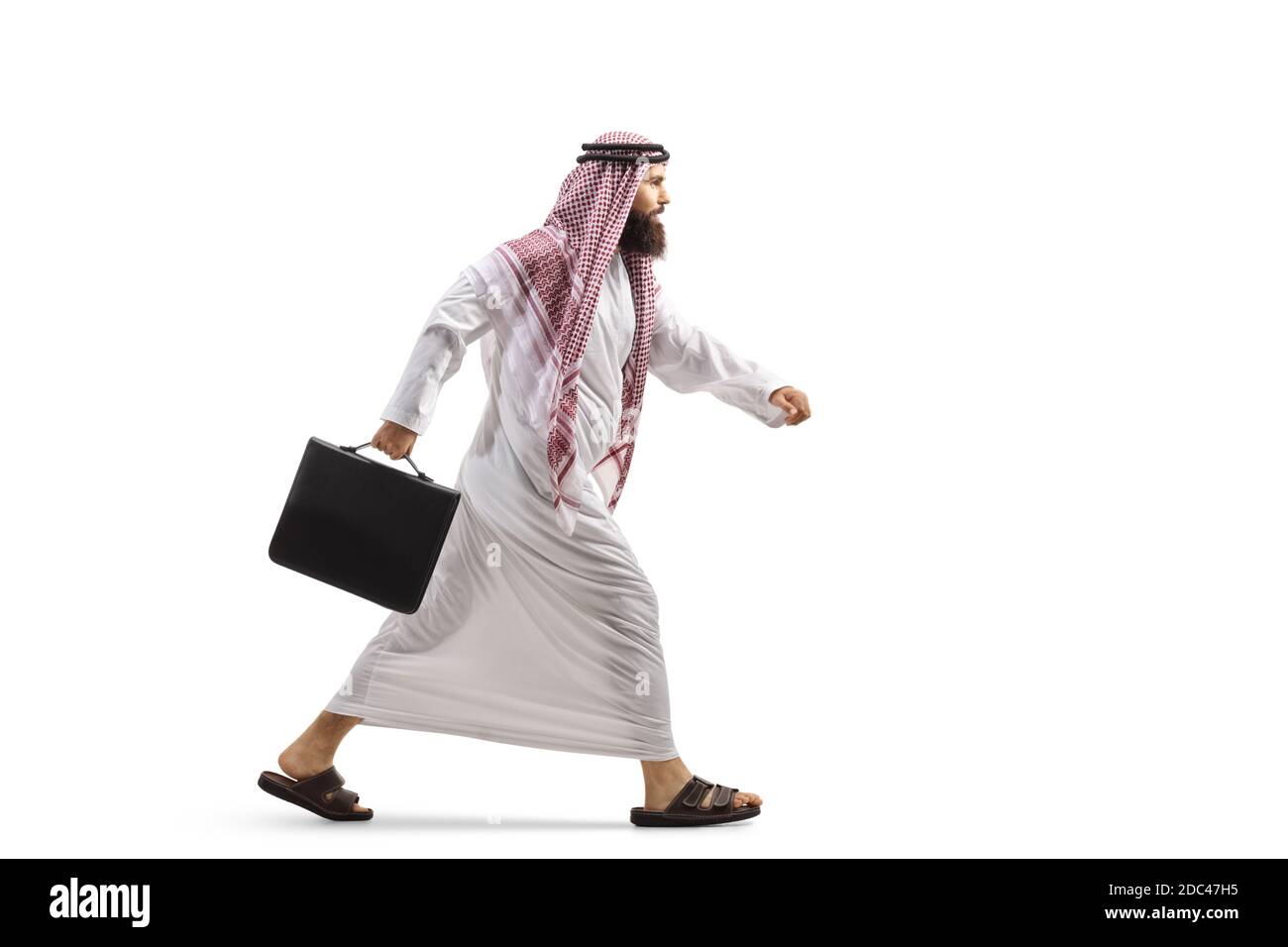 Full length profile shot of a saudi arab man with a briefcase running ...