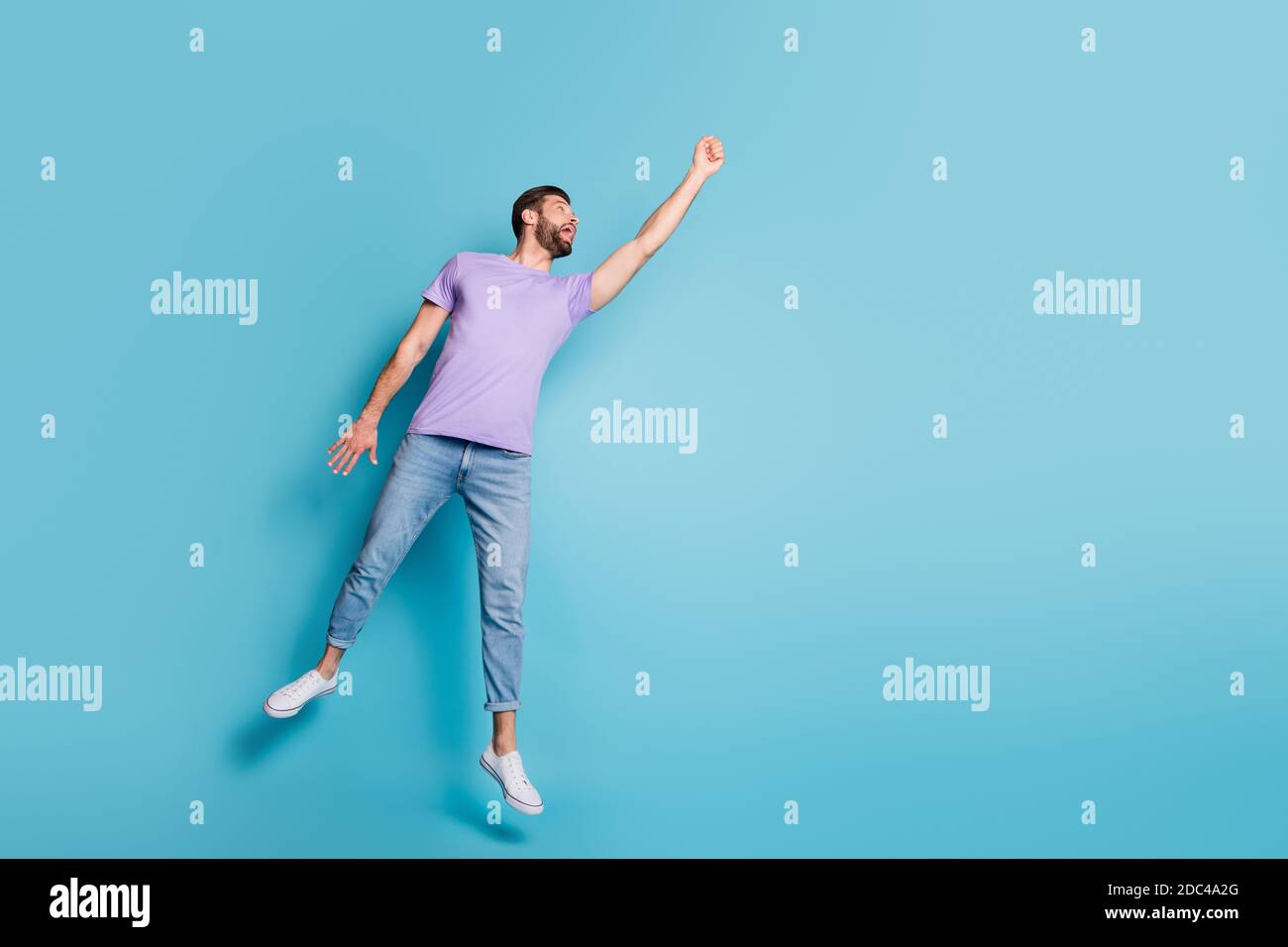 Full length body size photo of jumping man pretending superhero ...