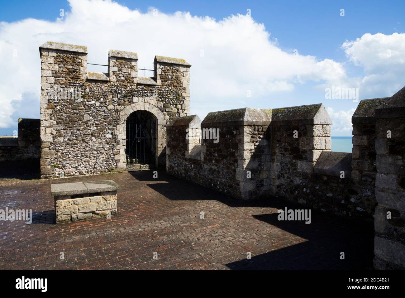 The roof and corner tower with castellated walls at the top of the ...