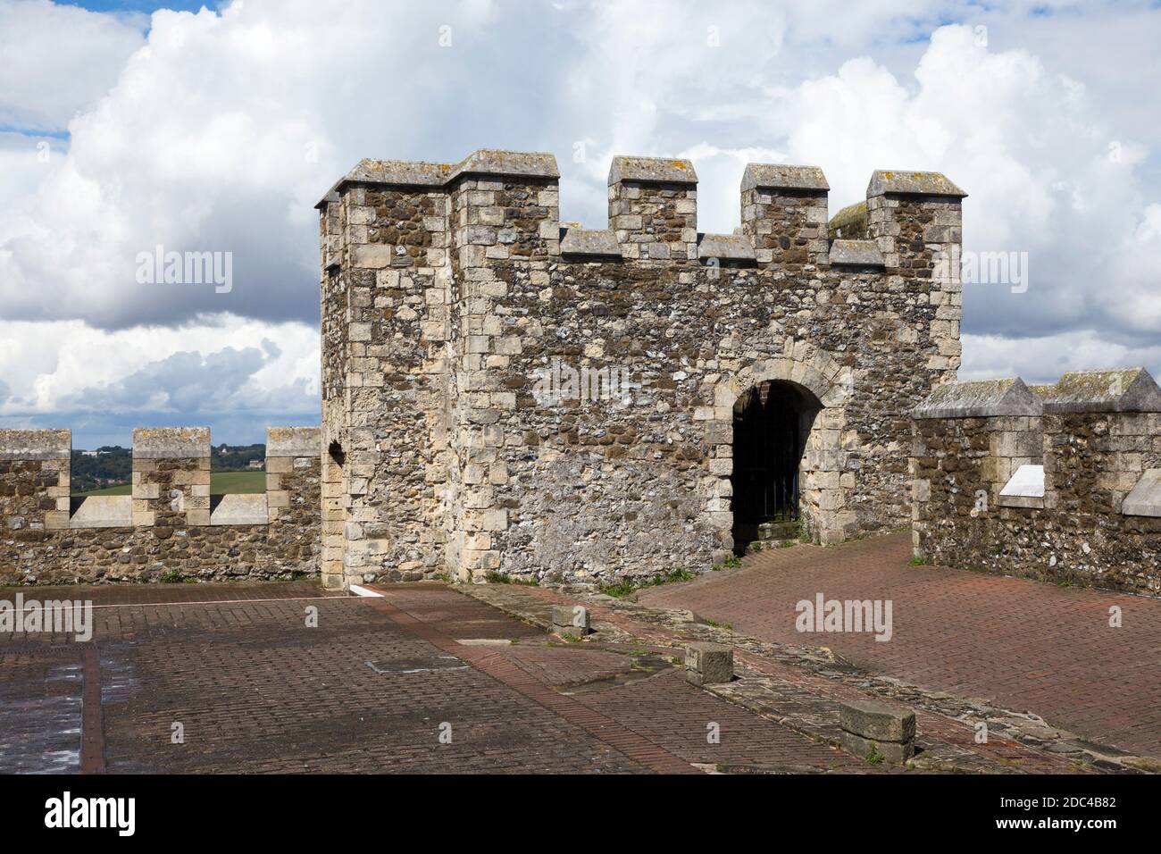 The roof and corner tower with castellated walls at the top of the ...