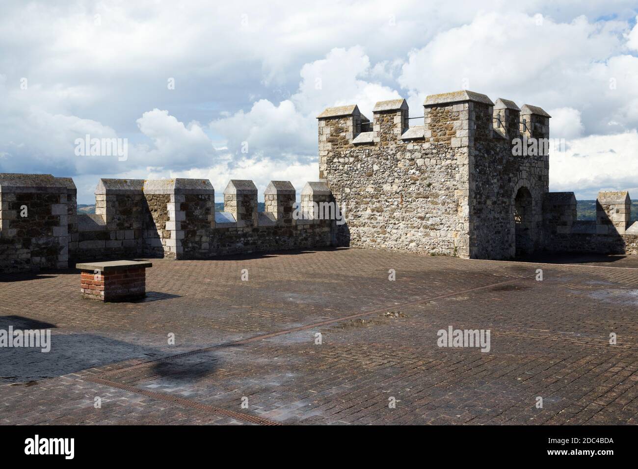 The roof and corner tower with castellated walls at the top of the ...