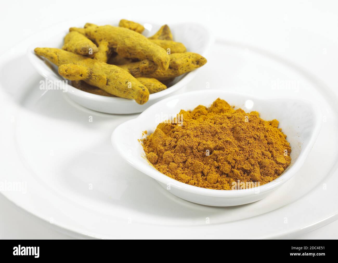 TURMERIC ROOT AND POWDER, AN INDIAN SPICE Stock Photo - Alamy