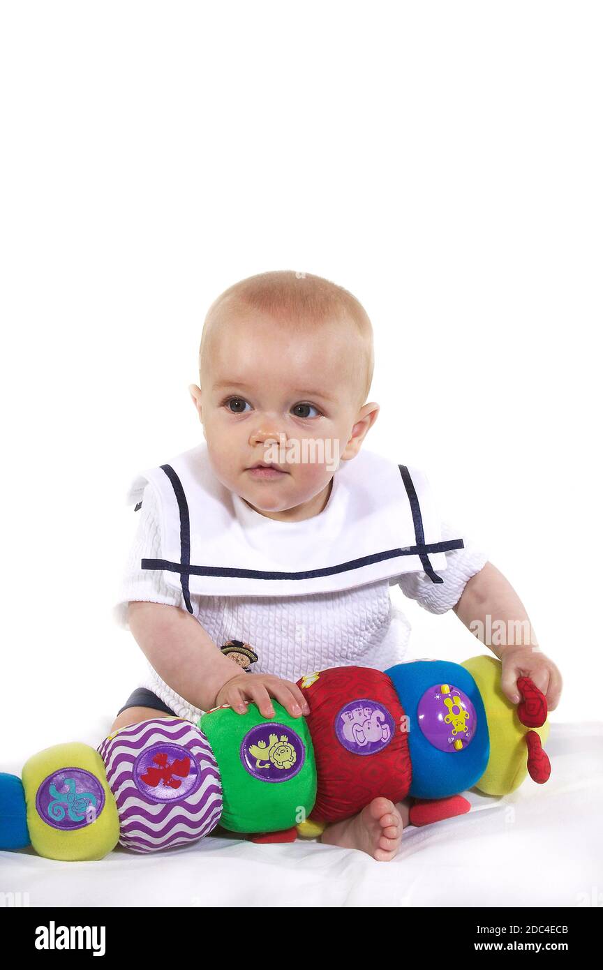 BOY PLAYING WITH A SOFT TOY Stock Photo - Alamy