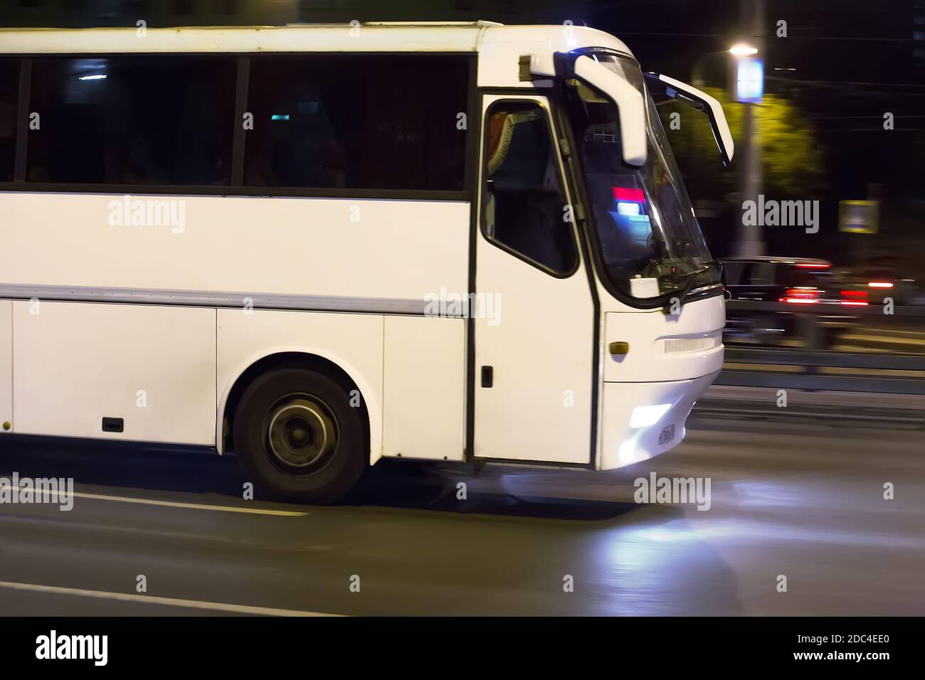bus moves on city street at night Stock Photo - Alamy