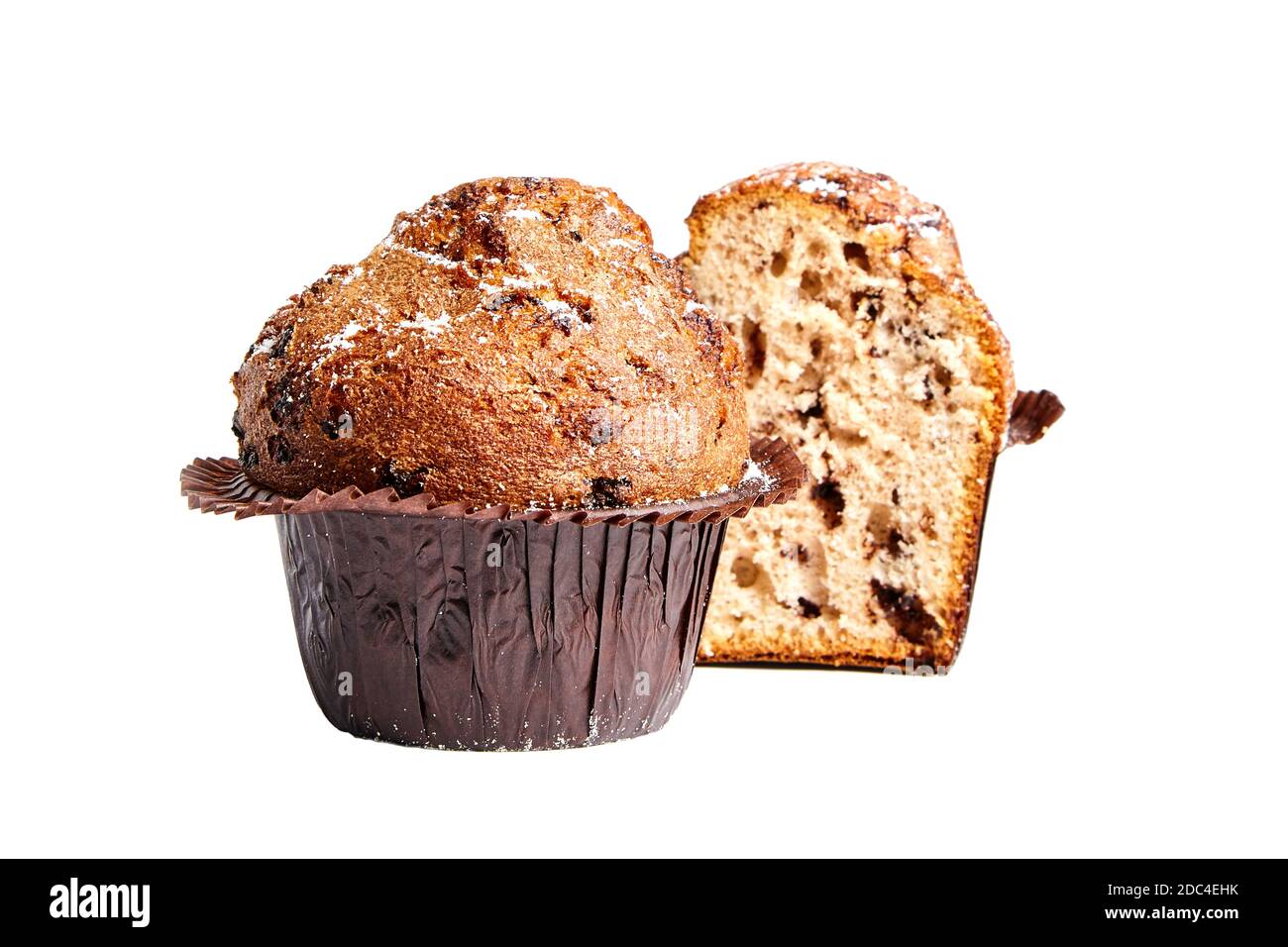 Half and whole muffin with chips of chocolate and powdered sugar ...