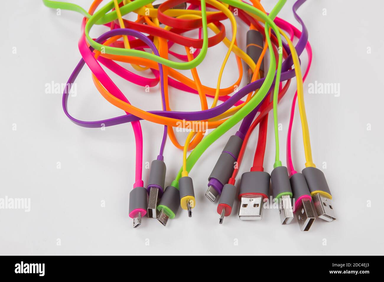 color wires with plugs on white background Stock Photo - Alamy
