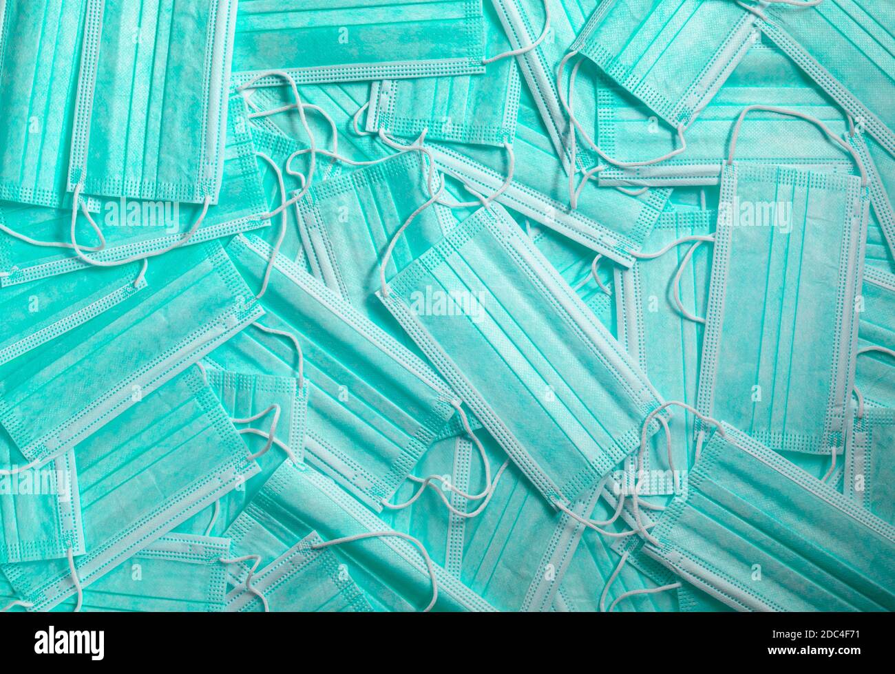 Medical green protective masks, texture. Top view Stock Photo - Alamy