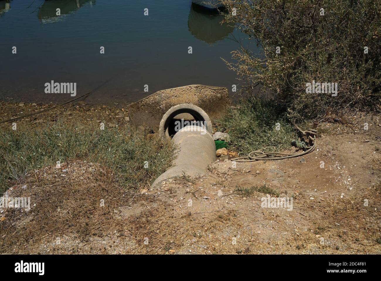Drain pipe through which apparently clean water flows Stock Photo - Alamy