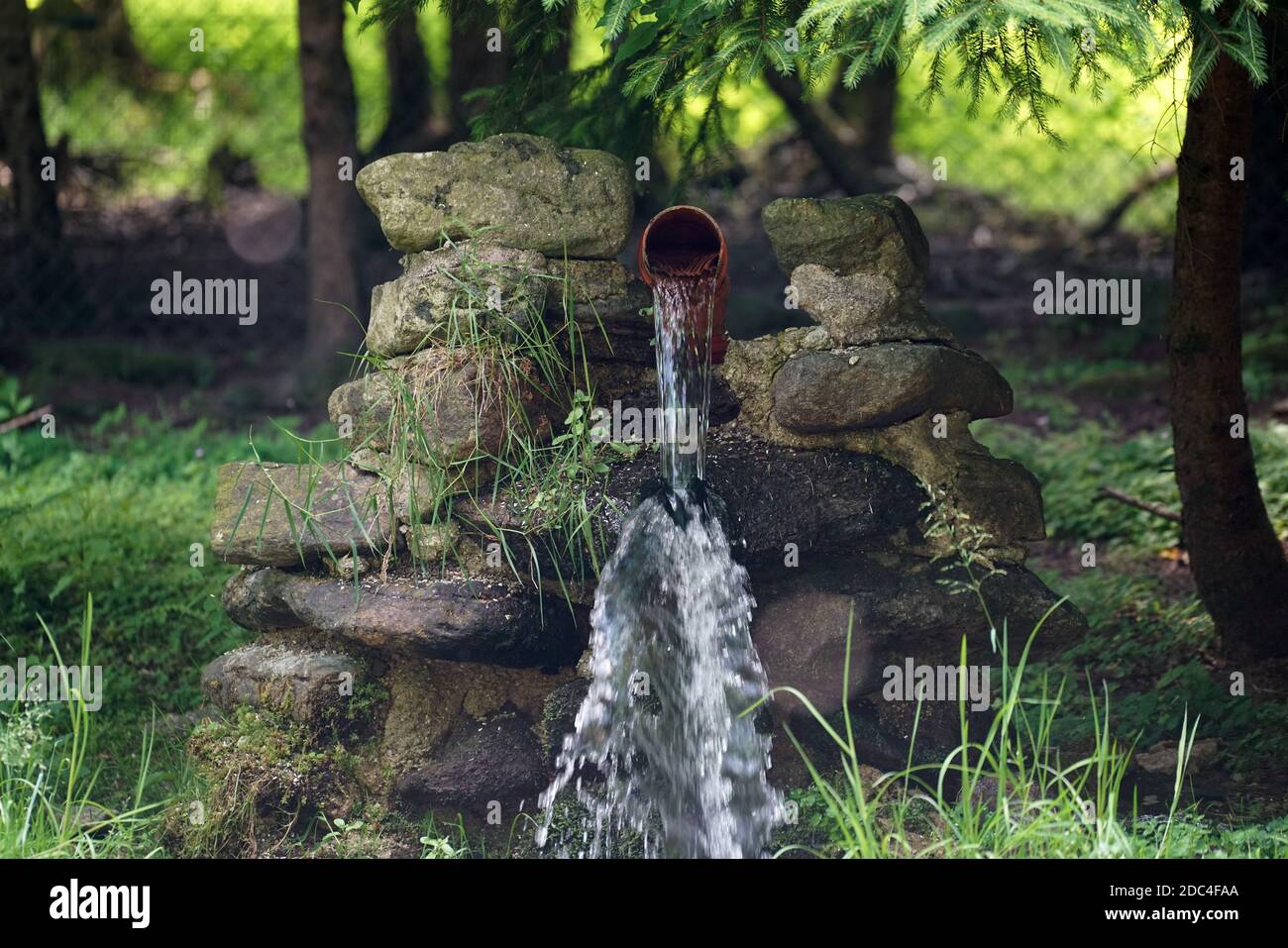 Drain pipe through which apparently clean water flows Stock Photo - Alamy