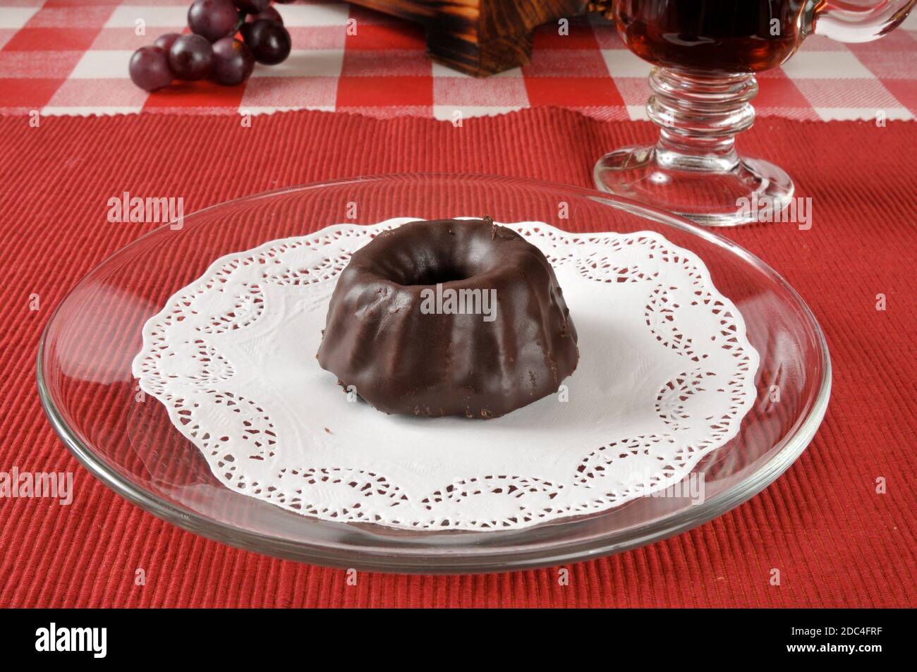 Chocolate covered bundt cake with a cup of coffee Stock Photo - Alamy