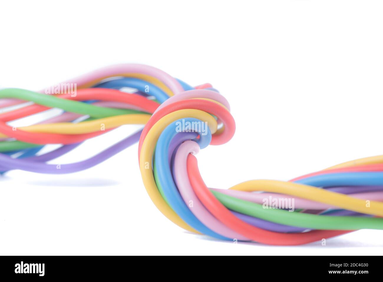 Swirl of colorful pastel electrical cable isolated on white background ...