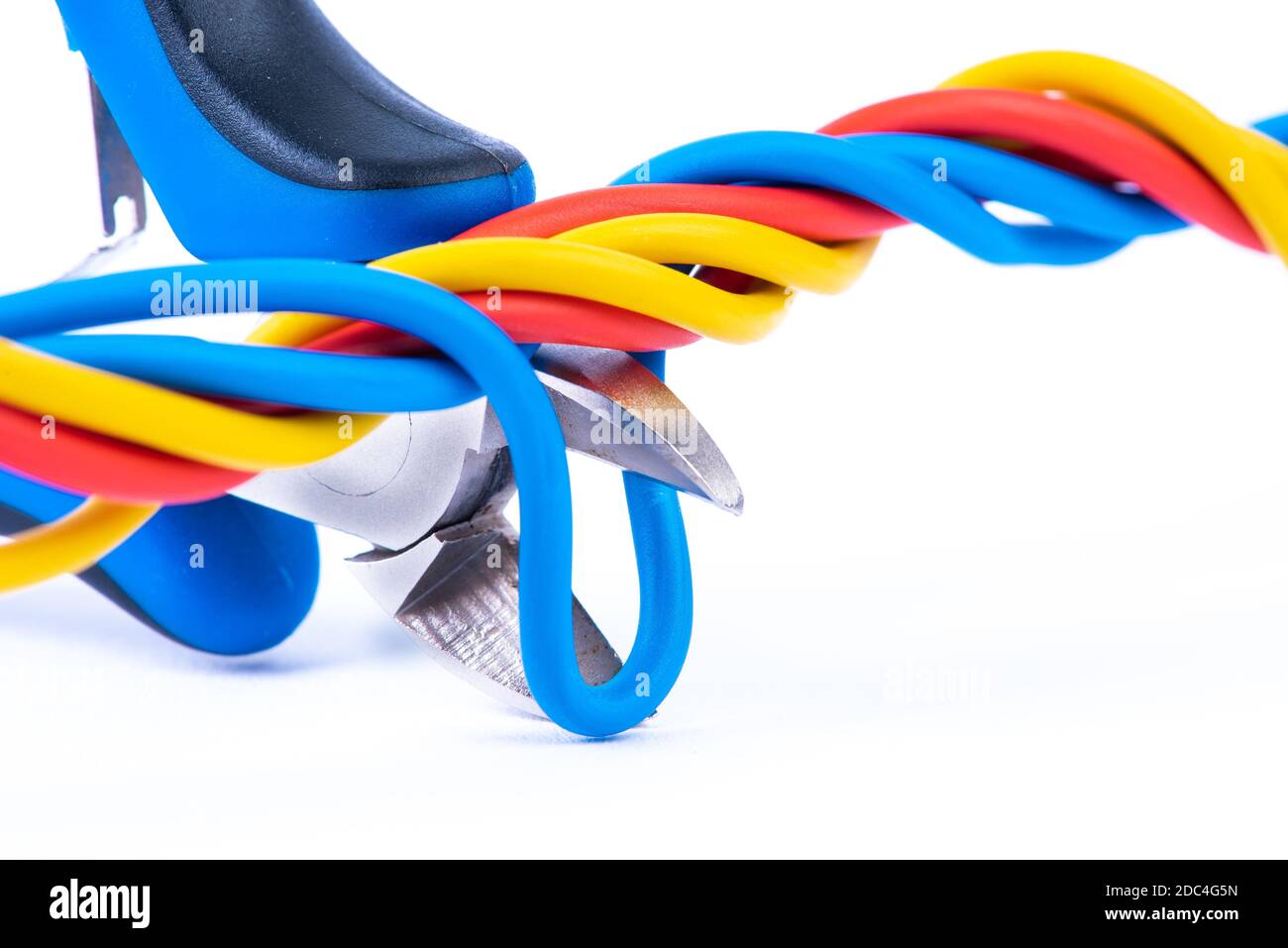 Electrical installation pliers and cabling close-up, isolated on white ...