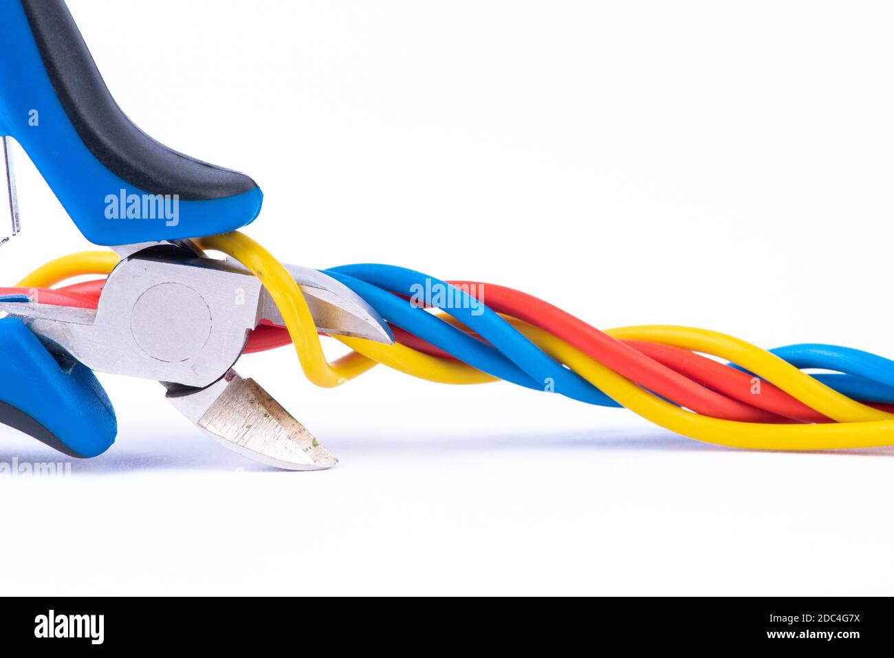 Electrical installation pliers and cabling close-up, isolated on white ...