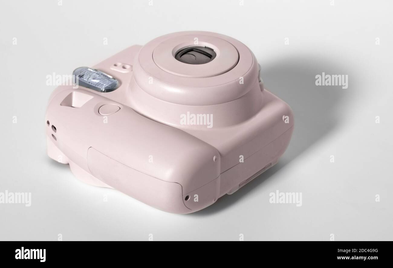 Old pink plastic camera on a white background Stock Photo - Alamy