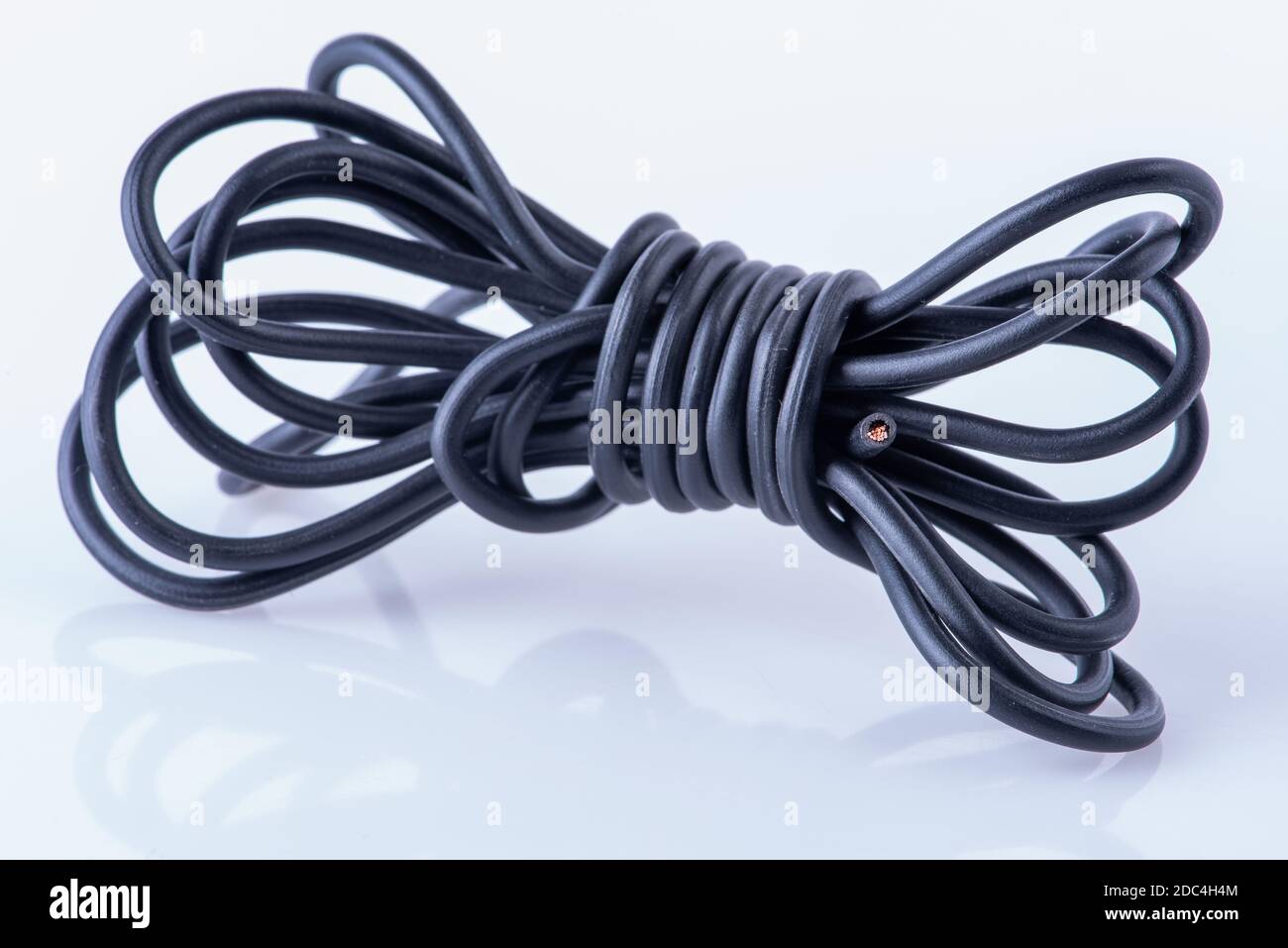 Electrical item rolled electric cable waste close-up Stock Photo - Alamy