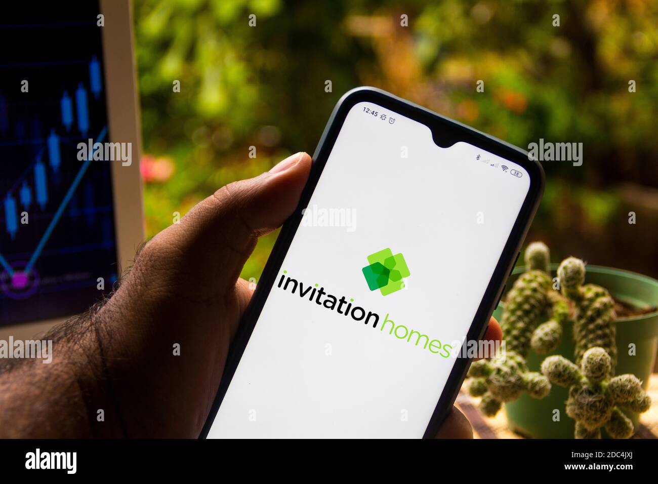 In this photo illustration the Invitation Homes logo seen displayed on ...