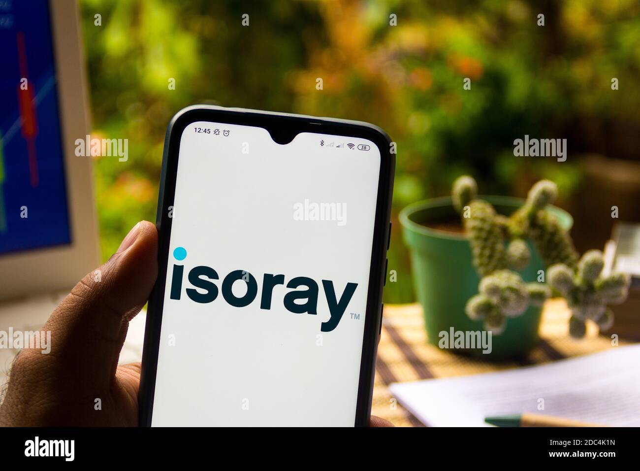 In this photo illustration the Isoray logo seen displayed on a ...