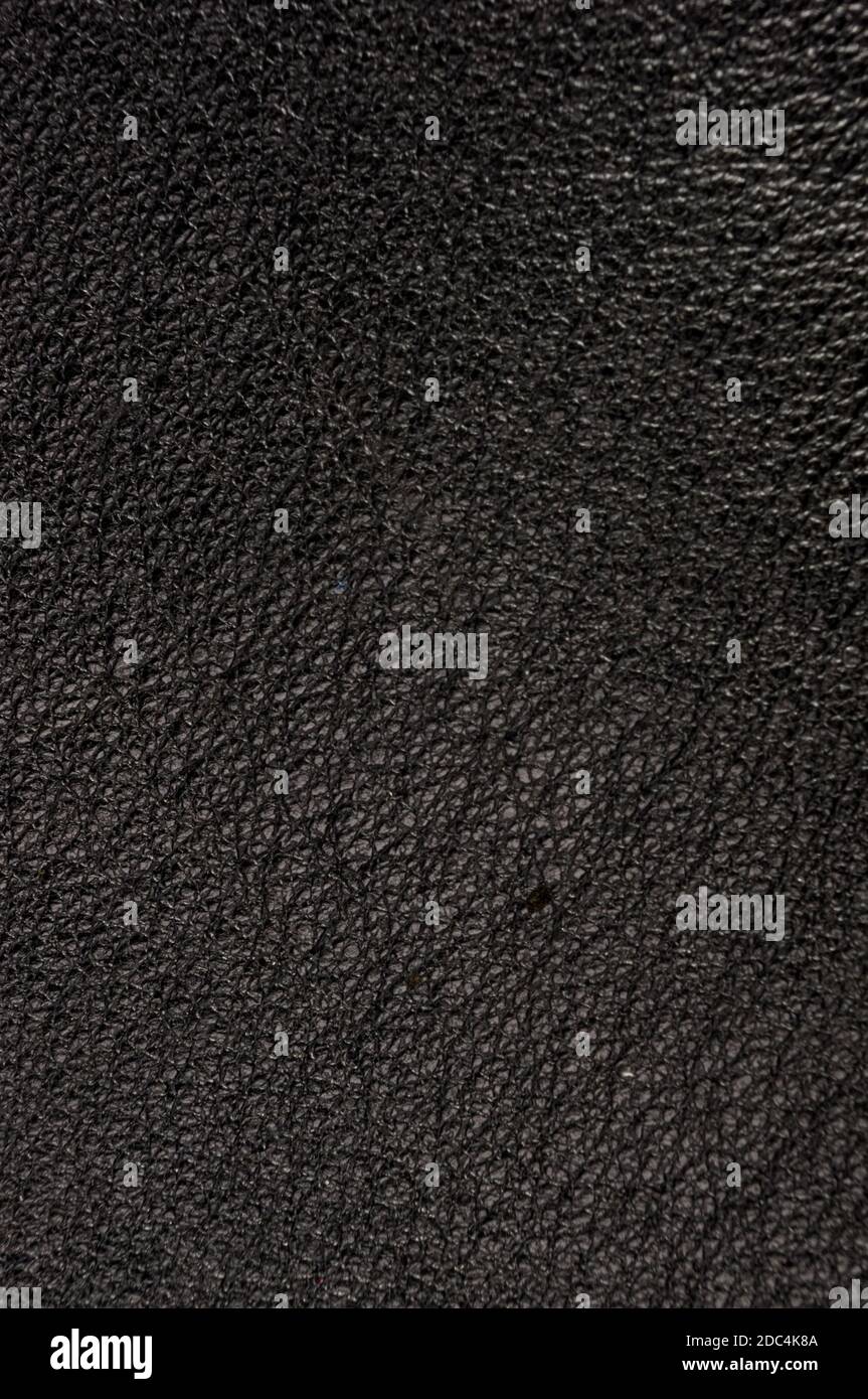 Old vintage genuine soft black leather texture background, top layer ...