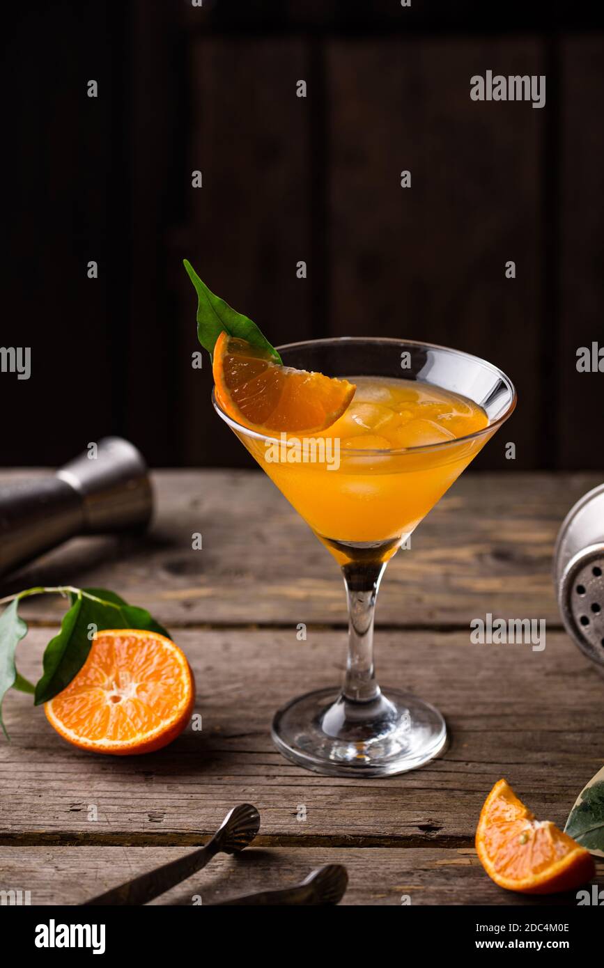 Orange martini cocktail in rustic style Stock Photo - Alamy