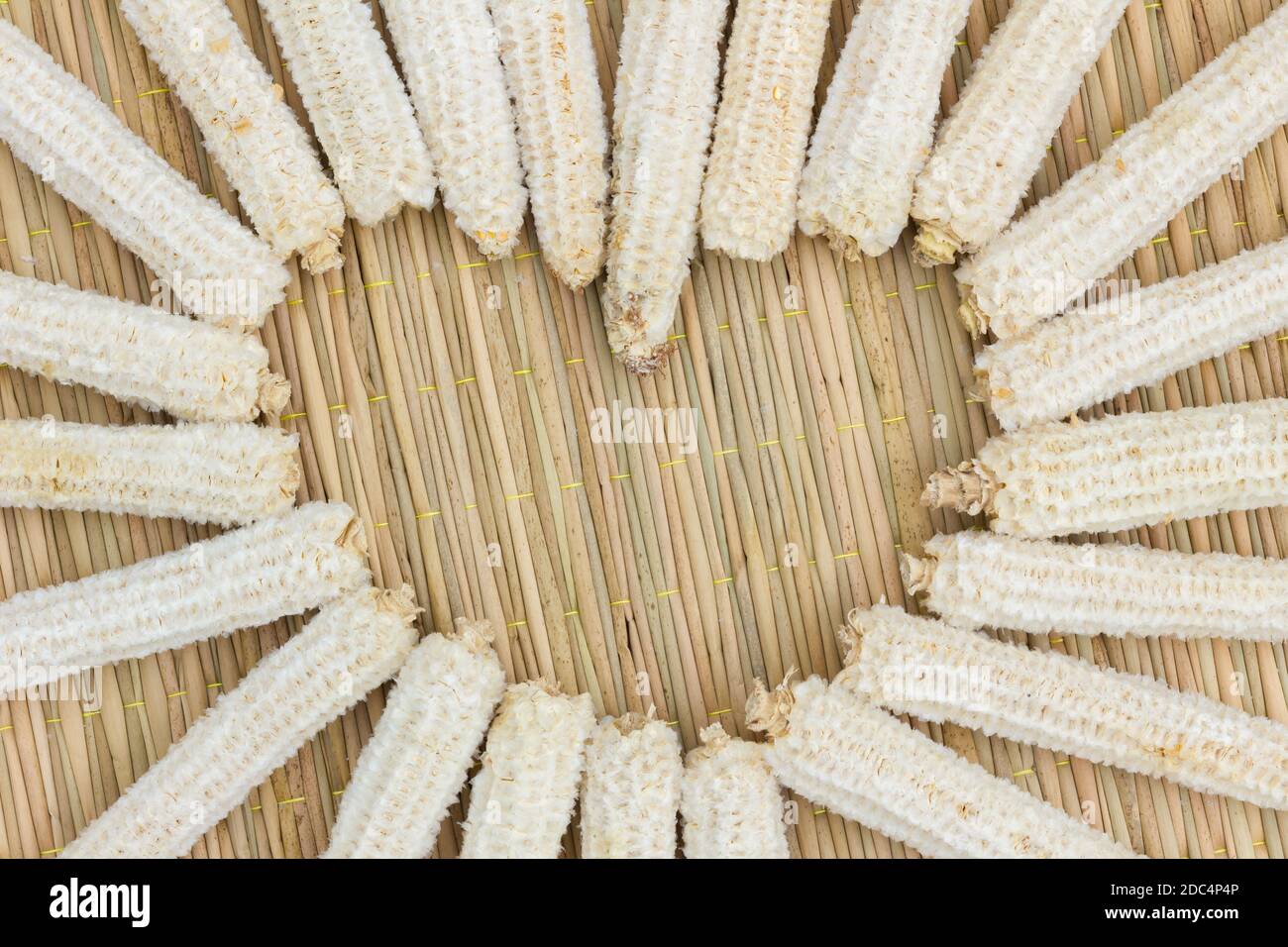 heart shape made of corn cobs on thai traditional mat, love concept ...