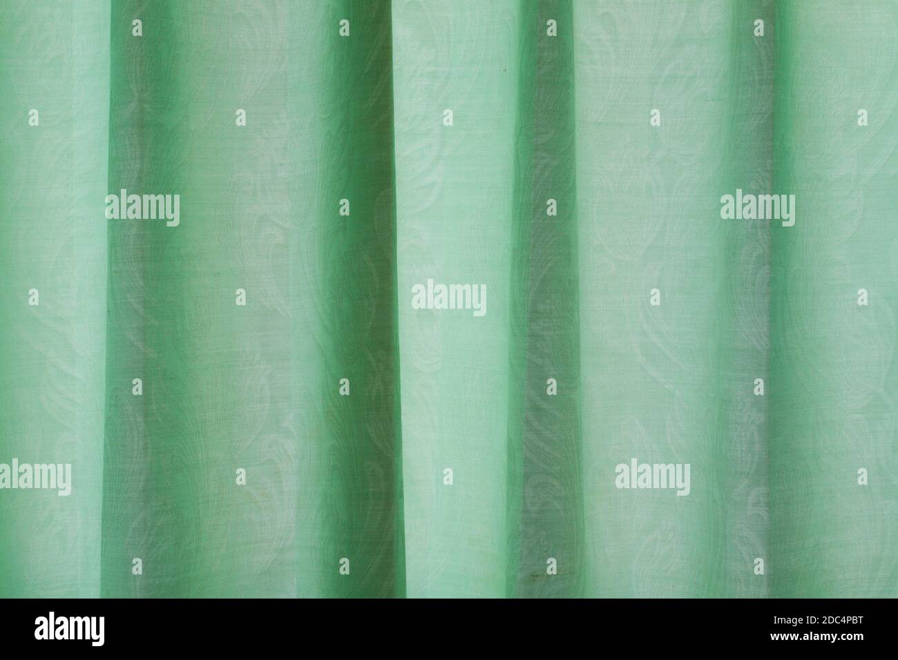Close-up view of bright green curtain. Textured abstract backgrounds ...