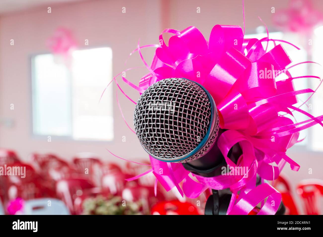 microphone with pink bow and ribbon in wedding ceremony hall Stock ...