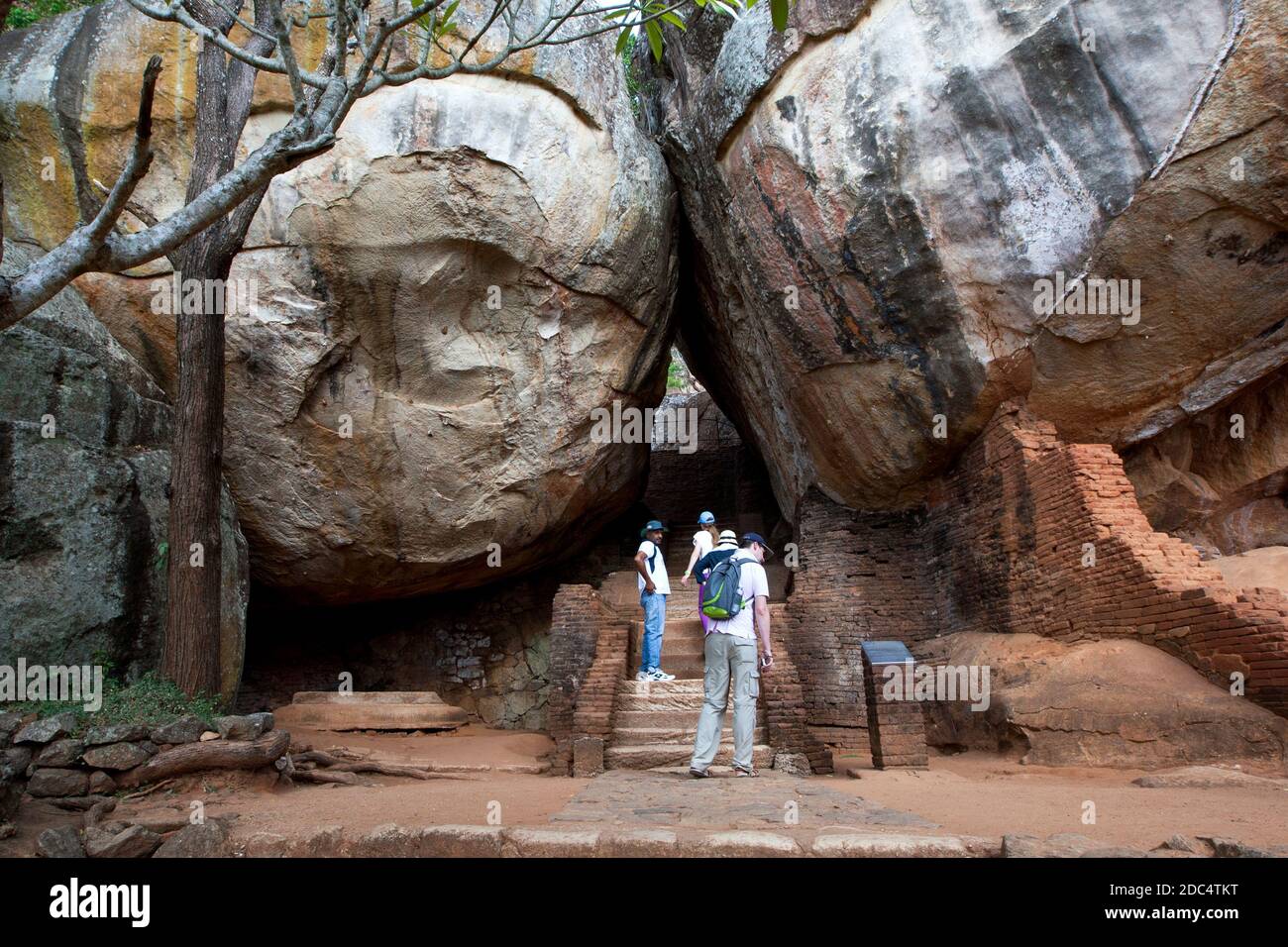 Visitors to Sigiriya Rock Fortress in Sri Lanka walk through Boulder ...