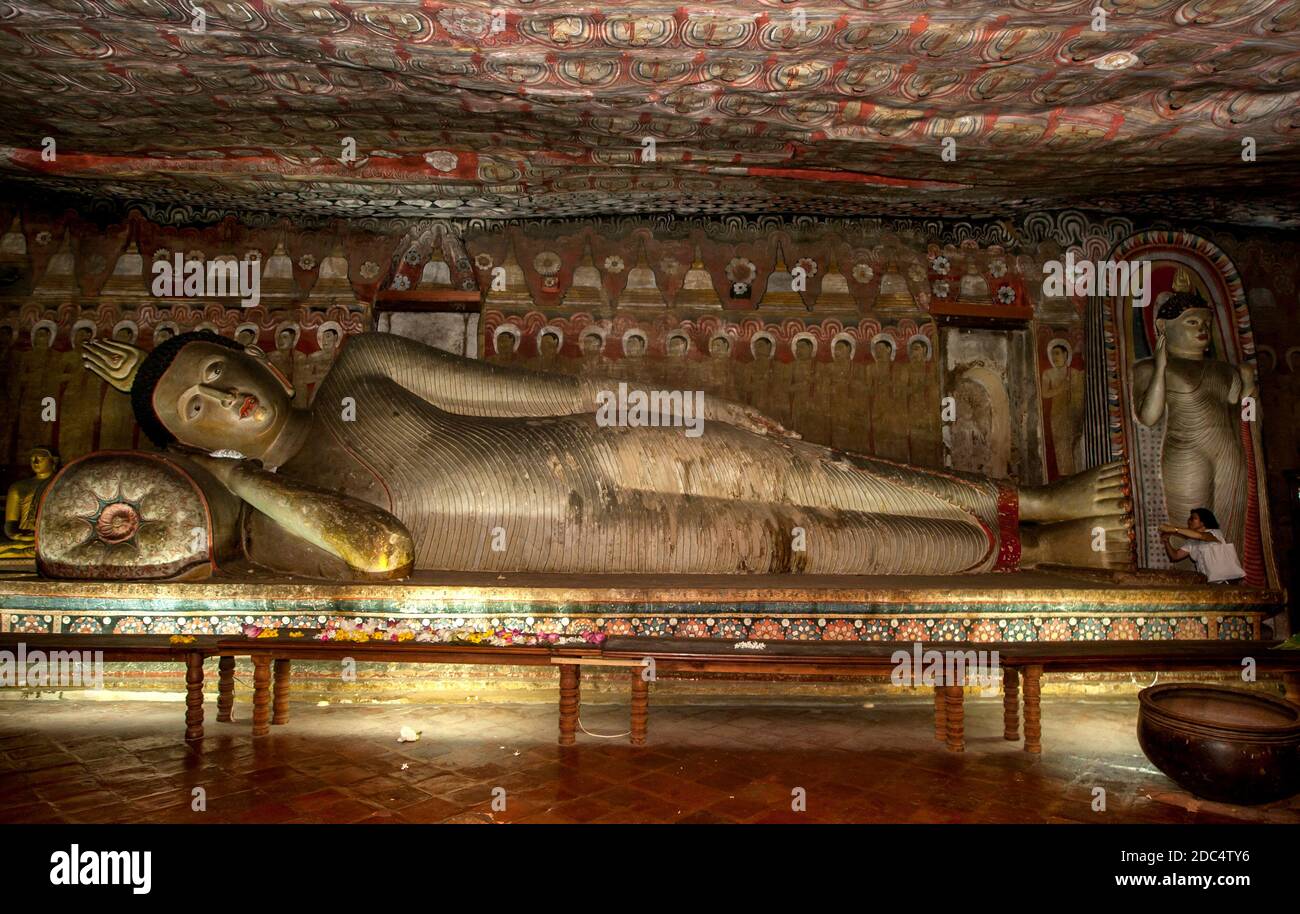 A giant reclining Buddha statue in Cave Two (Maharaja Viharaya) at the Dambulla Cave Temples in ...