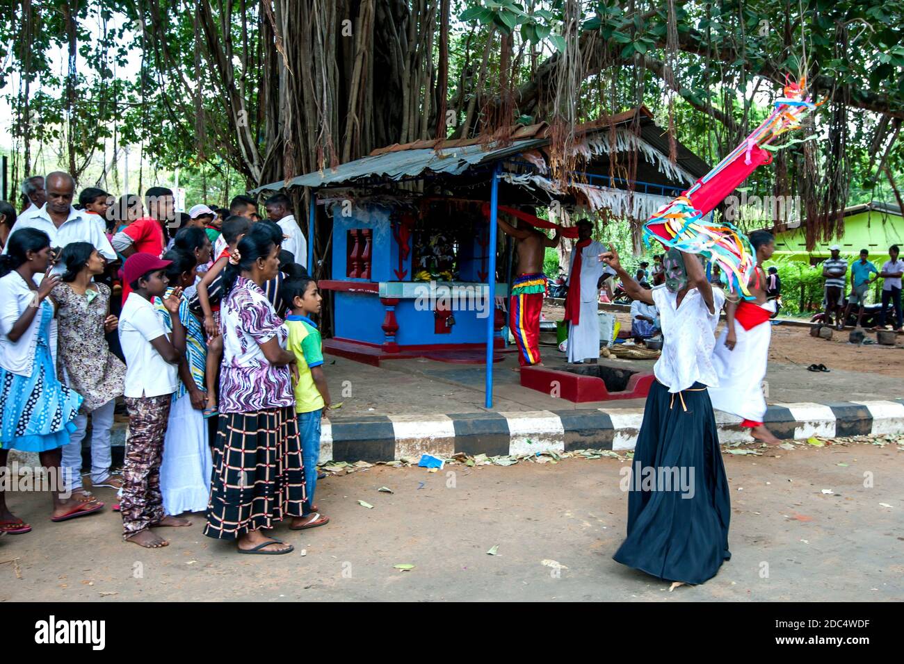Hindu dancers perform a chanting ritual for the god Pathine during a ...