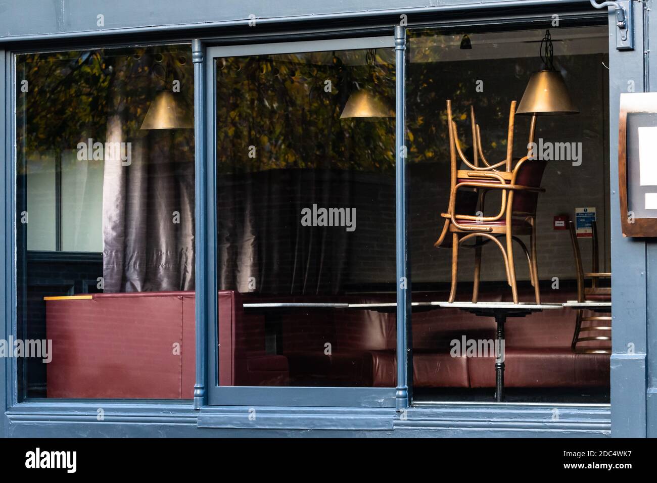 Window of an empty restaurant forced to close amid COVID-19 pandemic ...