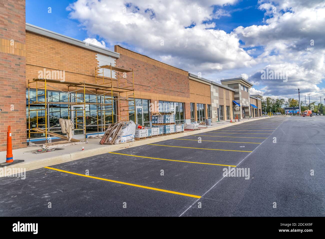 decorative rectangular pattern siding with brick veneer on a new strip ...