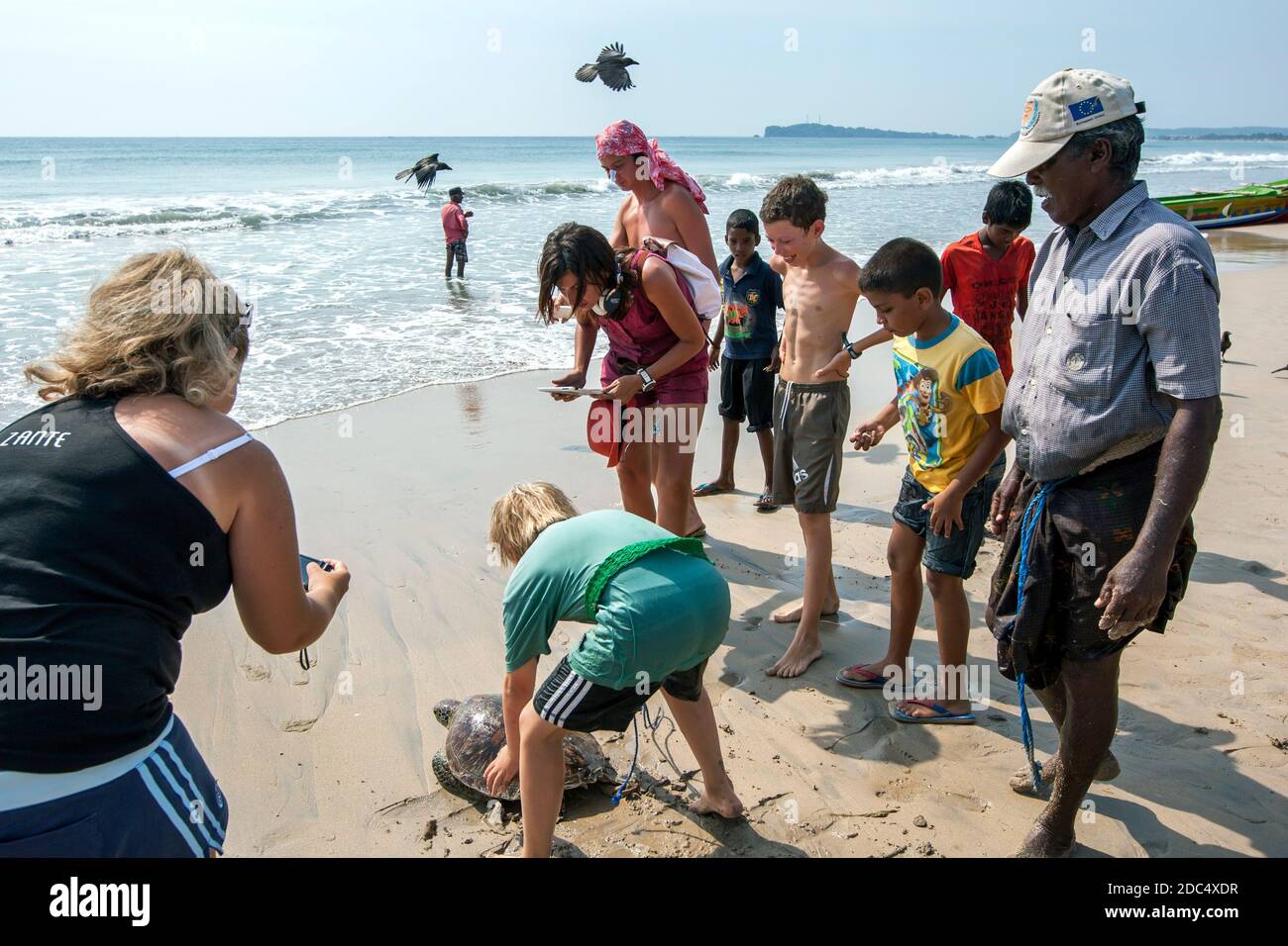 Woman fishing off beach hi-res stock photography and images - Alamy