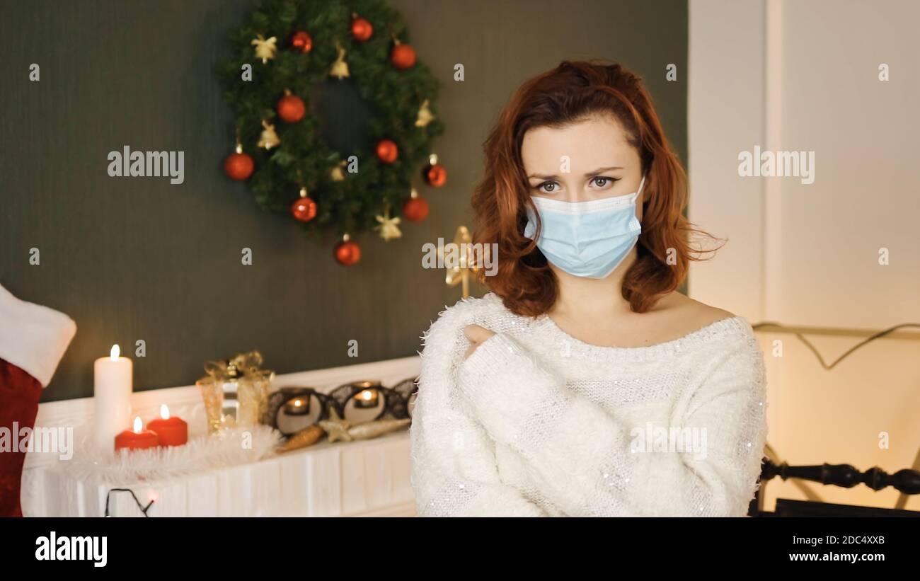 Pretty young woman in medical mask feeling down Stock Photo - Alamy
