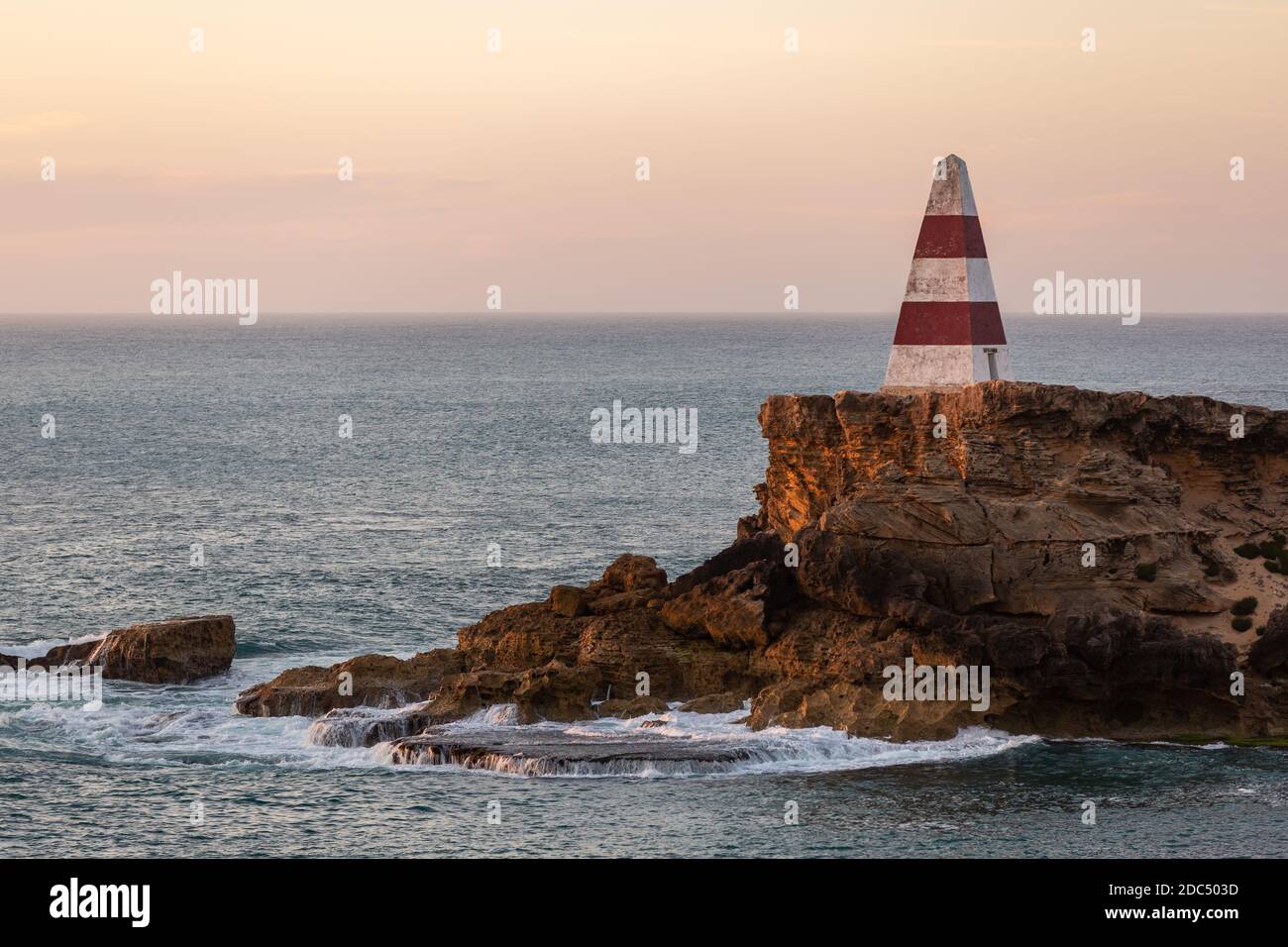 Sunset behind the iconic Obelisk built on now heavily eroding cliff ...