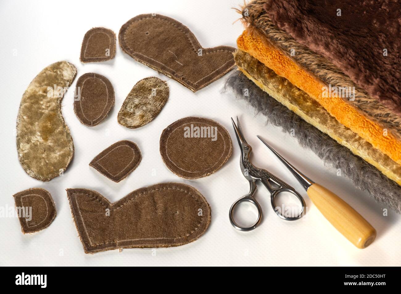 Sewing a teddy bear with yoyr own hands. Hobby. Cut out details of the ...