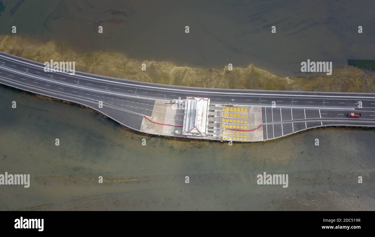 Aerial view to toll gate. Bali Mandara Gate. The reason behind it ...